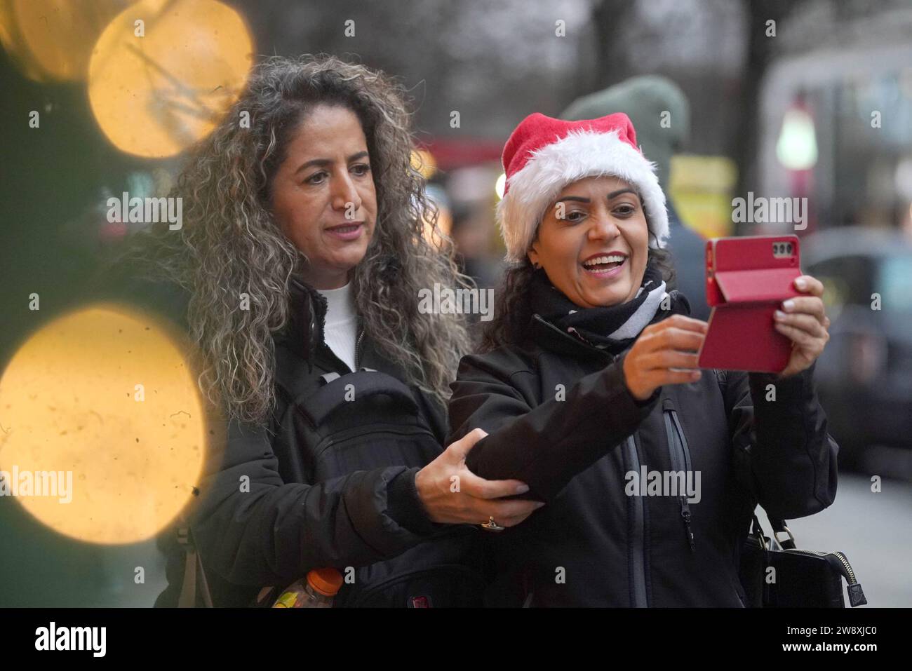 People shopping pass Selfridges in Oxford Street, central London ahead ...