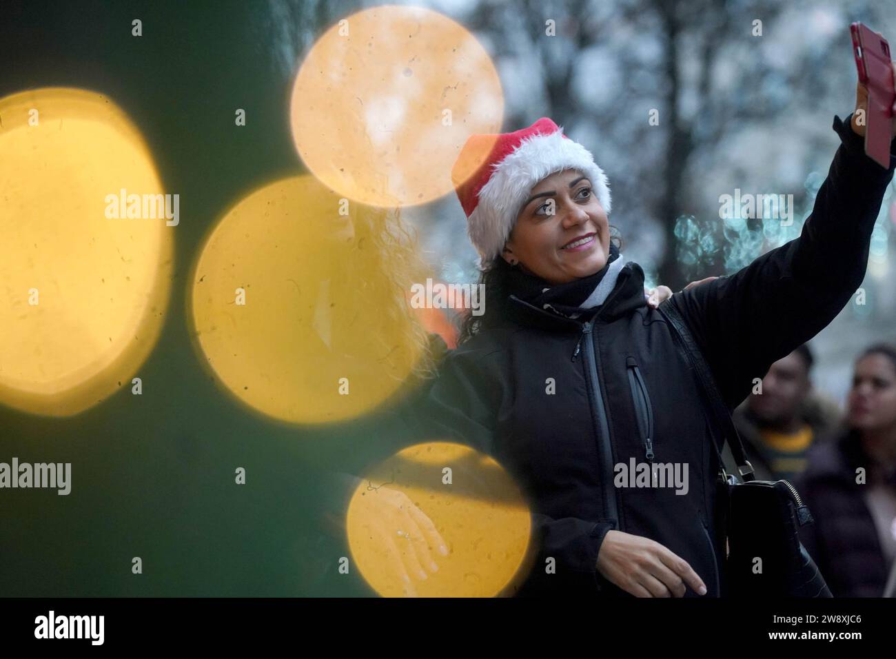 People shopping pass Selfridges in Oxford Street, central London ahead ...