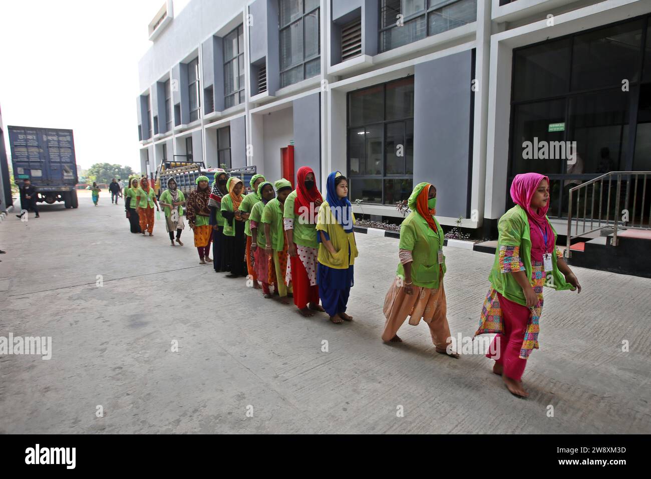 Garment workers going to a garment factory to work in Dhaka, Bangladesh on December 19, 2023 ...