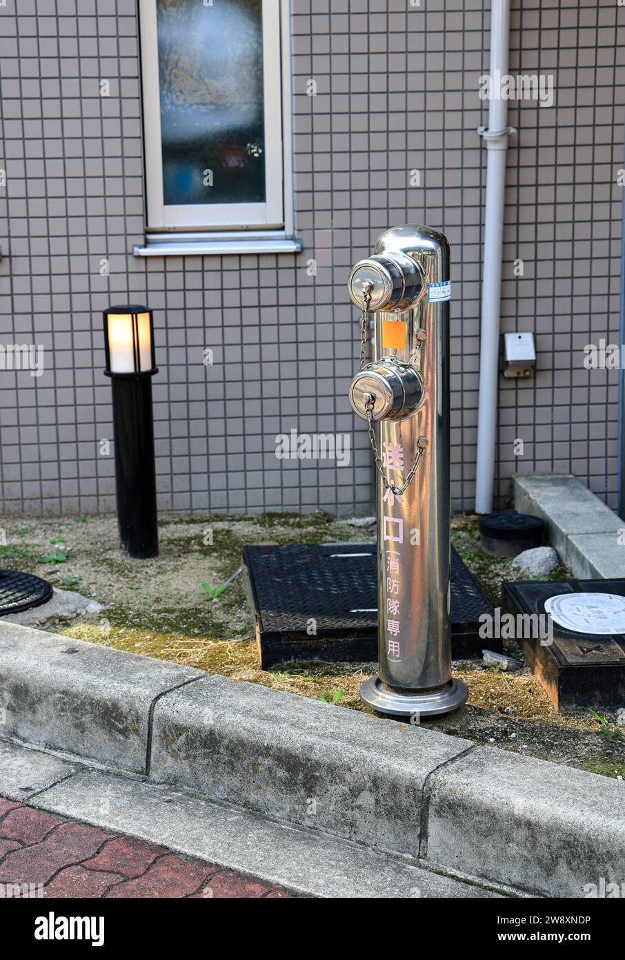 Fire hydrant on the street near old town of osaka Japanese Language ... Fire hydrant on the street near old town of osaka Japanese Language ...