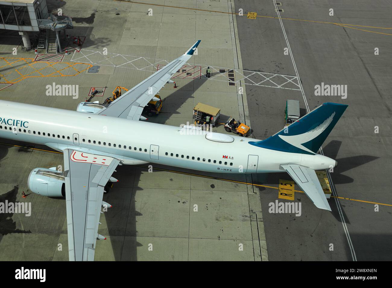 White strip and red arrow over the cathay Pacific Airway airplane wing ...