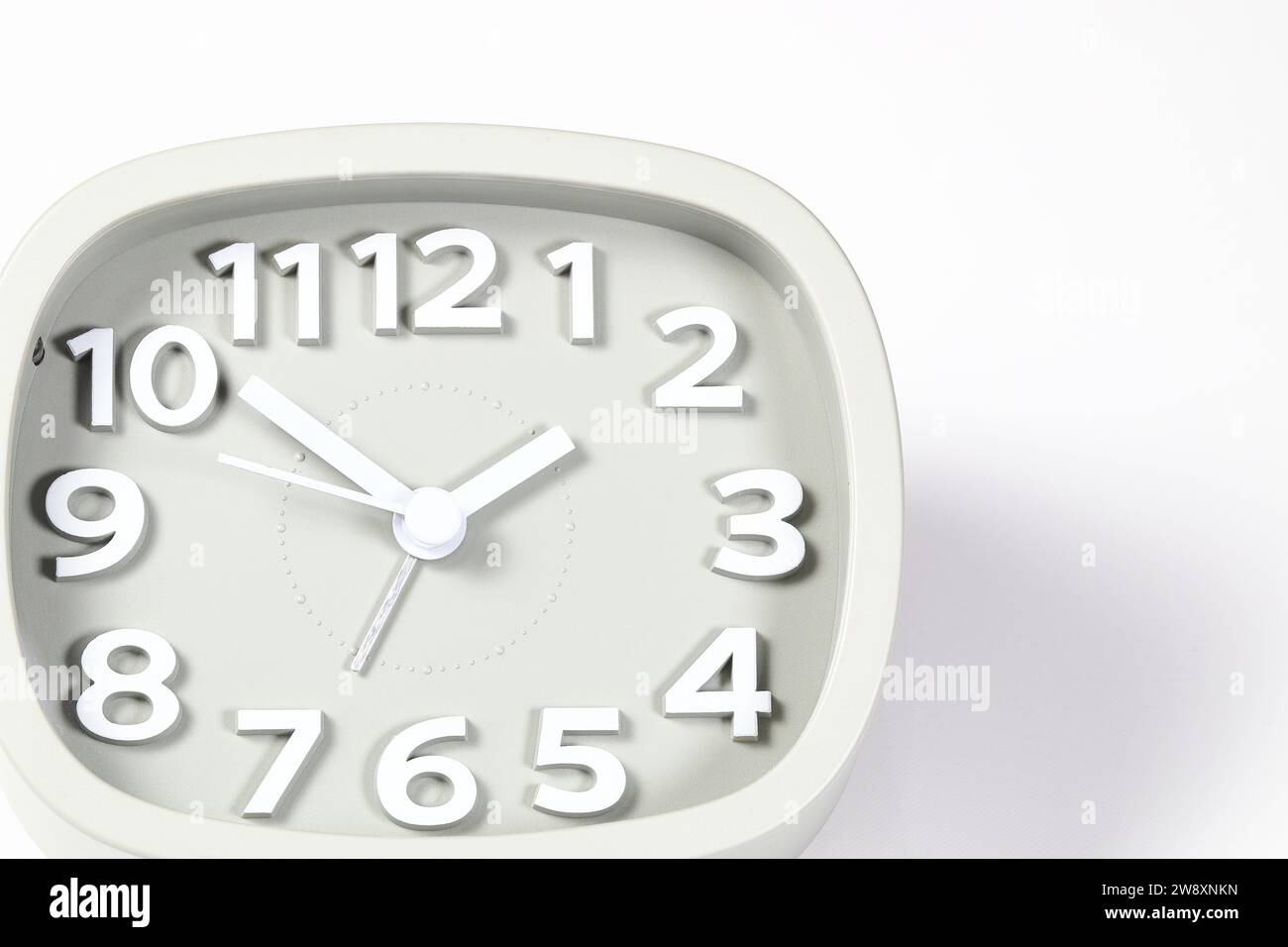 Cheap gray quartz alarm clock isolated on white background Stock Photo ...
