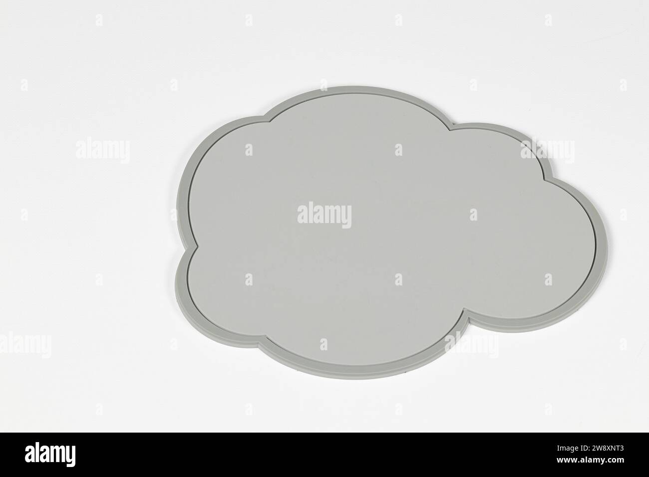 cloud like shape coaster isolated on white background Stock Photo - Alamy