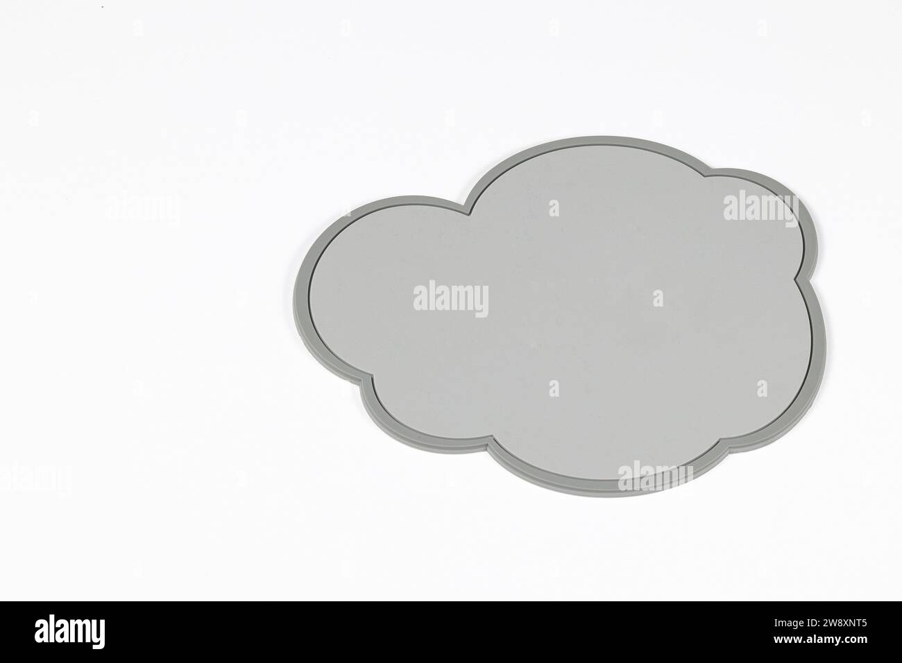 cloud like shape coaster isolated on white background Stock Photo - Alamy