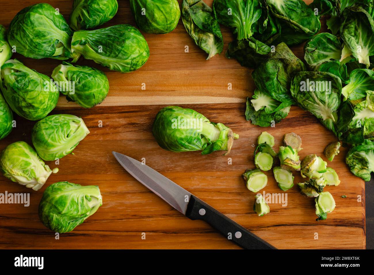 Trimmed Brussels Sprouts on a Wooden Cutting Board: Peeled and trimmed ...