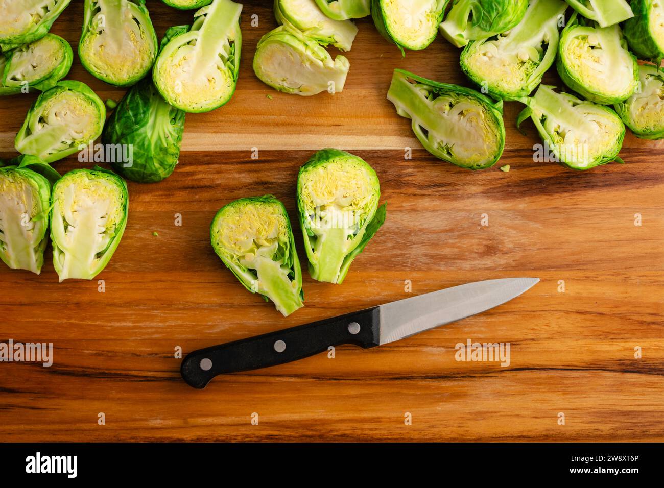 Halved Brussels Sprout Viewed Close Up on a Wood Cutting Board: Fresh ...
