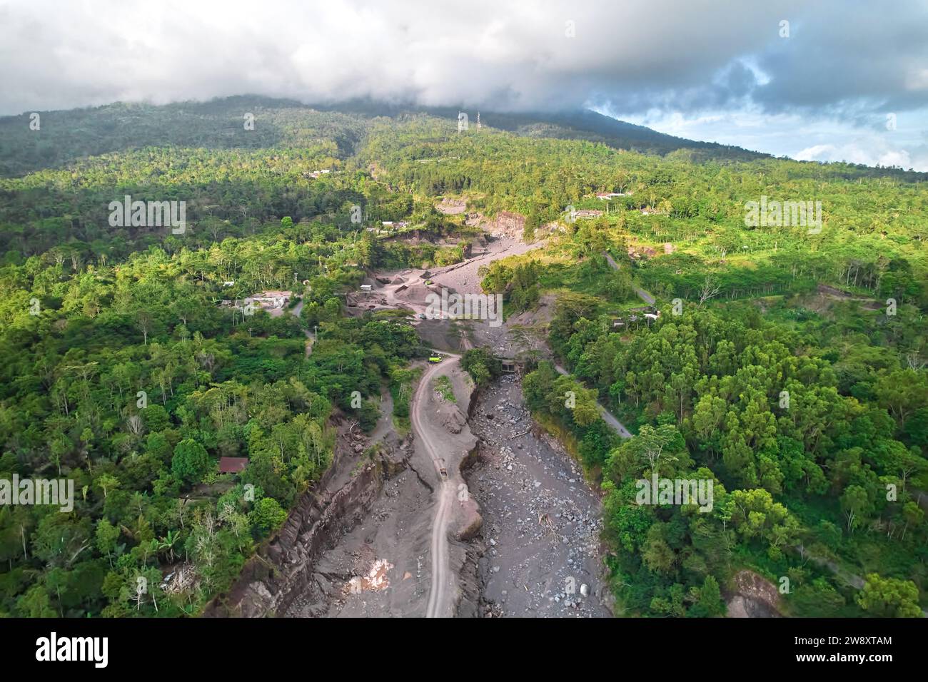 A beautiful valley under an active volcano. An old river made of ash ...