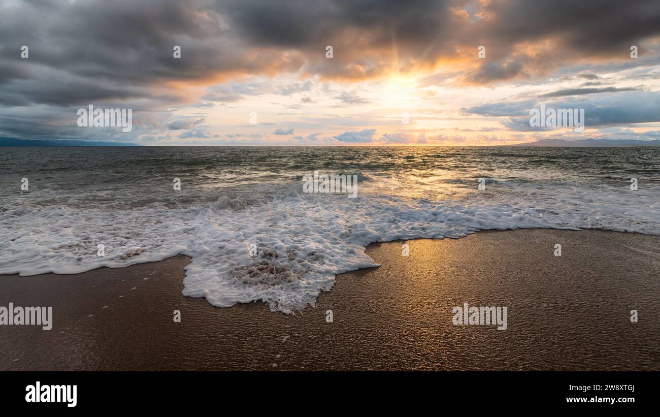 An Ocean Seascape With Golden Sun Rays Breaking Through The Clouds 16:9 ...