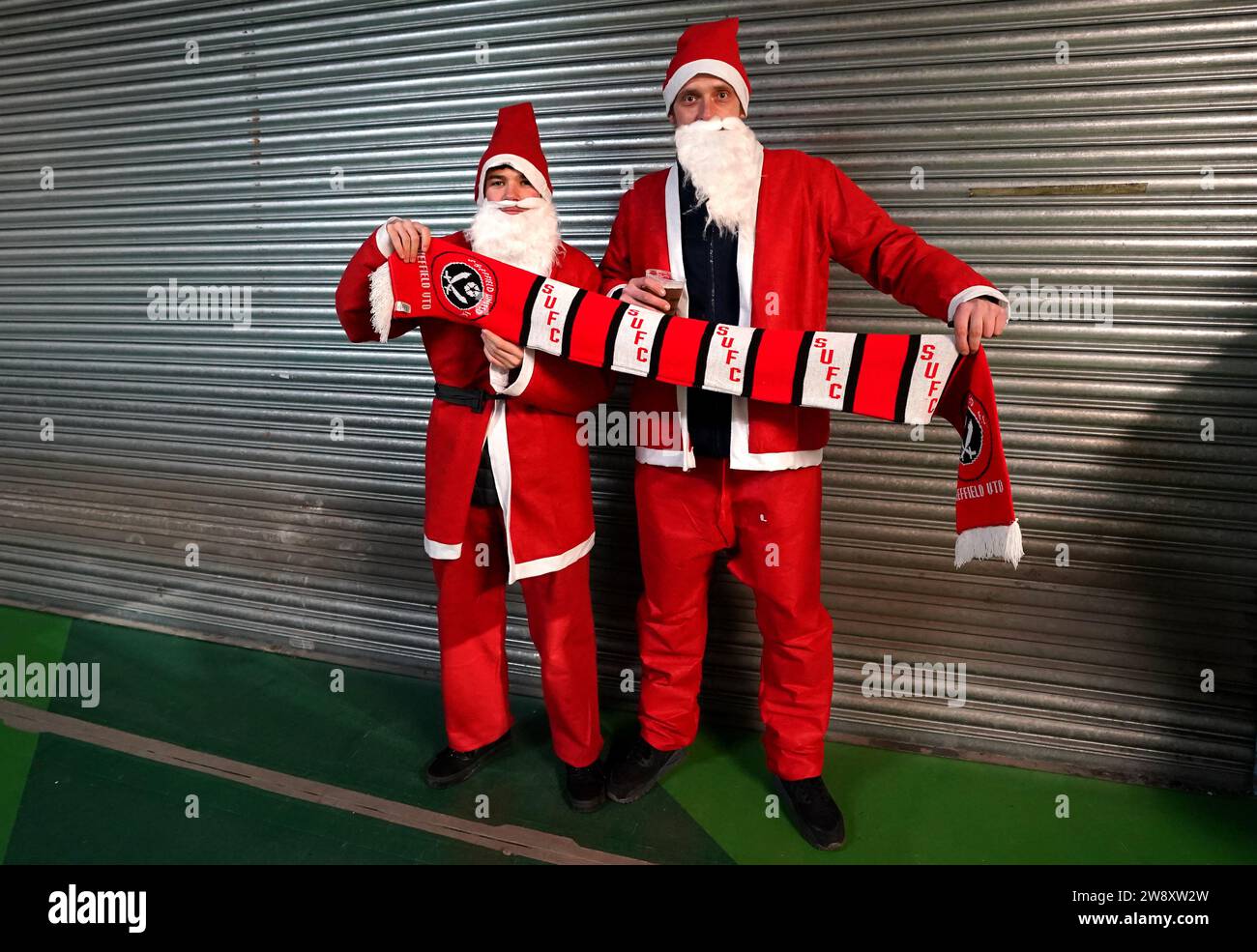 Sheffield United fans dressed as Santa Claus inside the stadium before ...