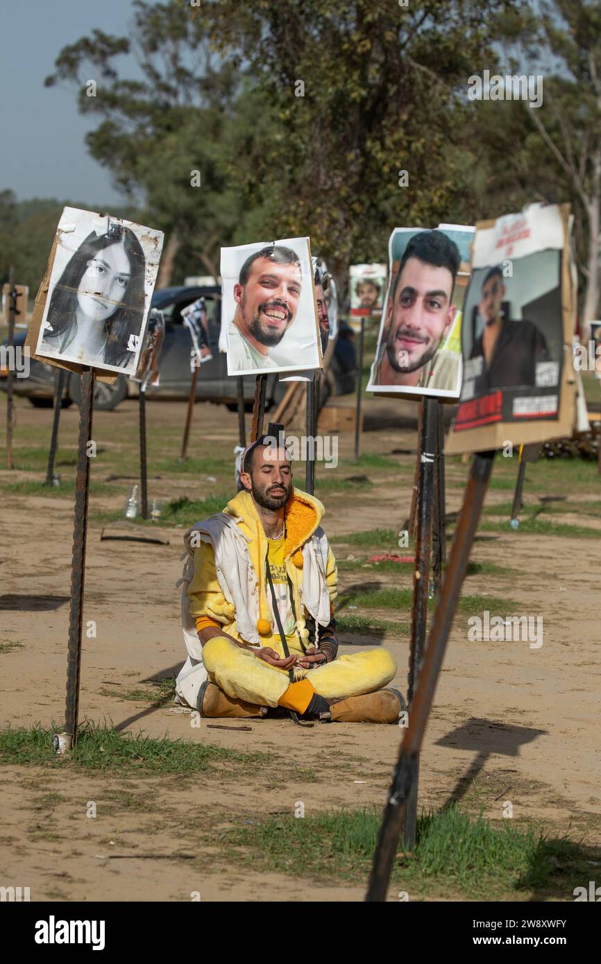 Yonatan Hinon, 30, from Jerusalem, prays and mourns at a photo of one ...