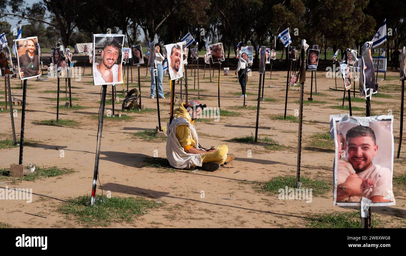 Yonatan Hinon, 30, from Jerusalem, prays and mourns at a photo of one ...