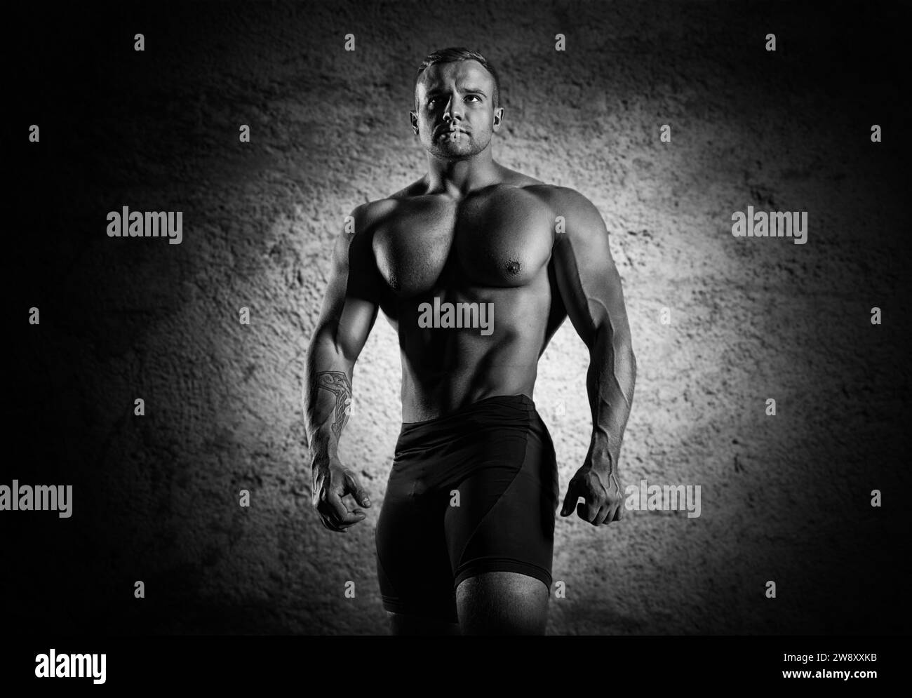 Portrait of a weightlifter who poses without a shirt. Front view Stock ...