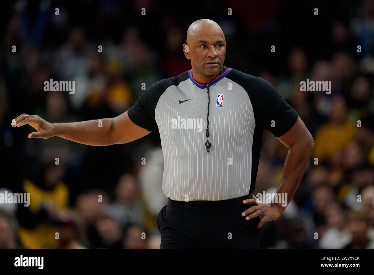 Referee Kevin Cutler signals during the first half of an NBA basketball ...