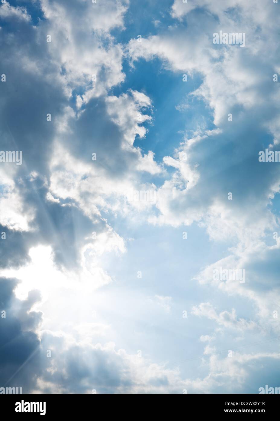 Contrast between blue sky and sun Stock Photo - Alamy