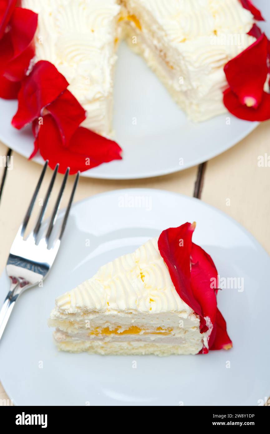 Whipped cream mango cake with red rose petals, food photography Stock ...