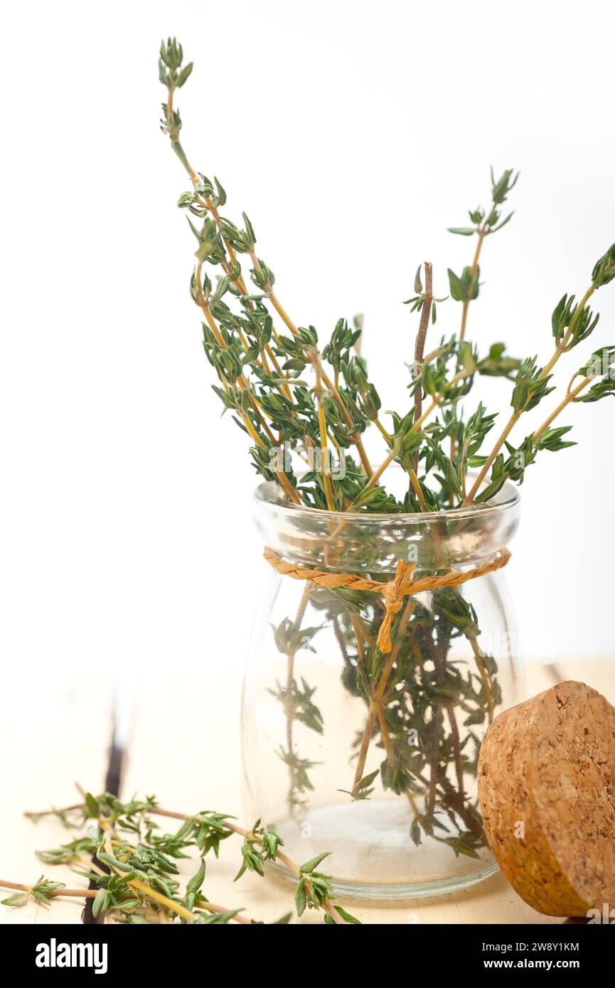 Fresh thyme on a glass jar over a white wood rustic table, Food ...