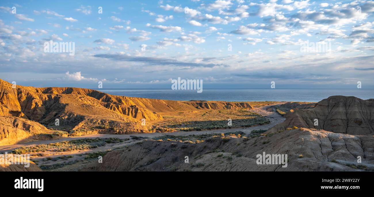 Landscape of eroded hills at sunrise, badlands, Issyk Kul Lake in the ...