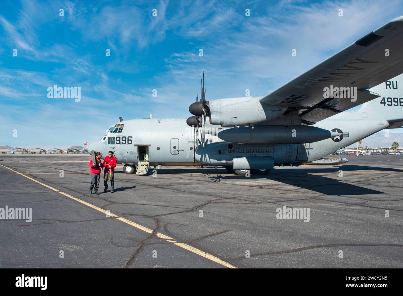 Parked up and chocks wedged, a C130 of the US NAVY sits on the ramp at ...