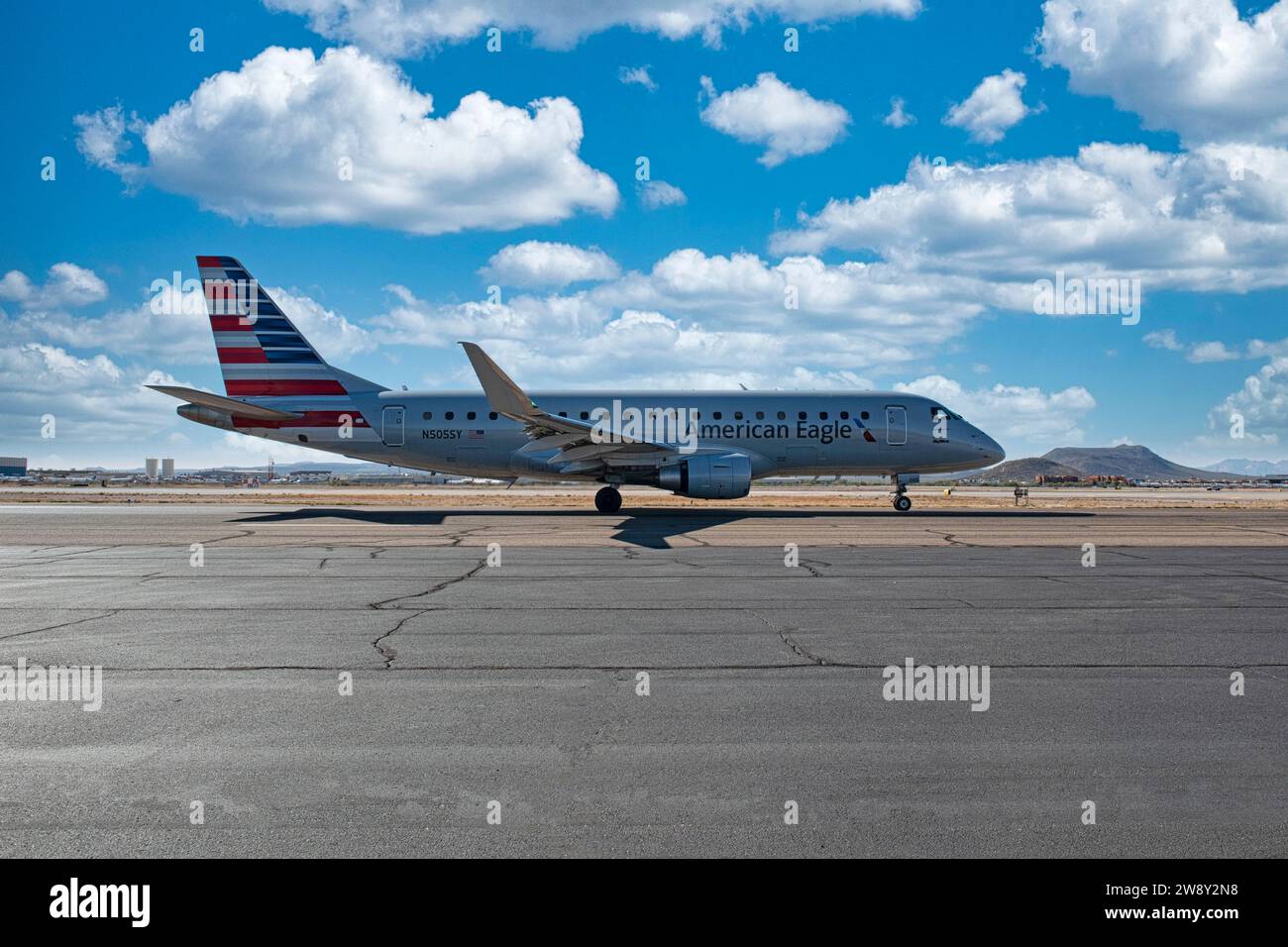 American Airlines Eagle Embraer E175LR taxies to the active runway at ...