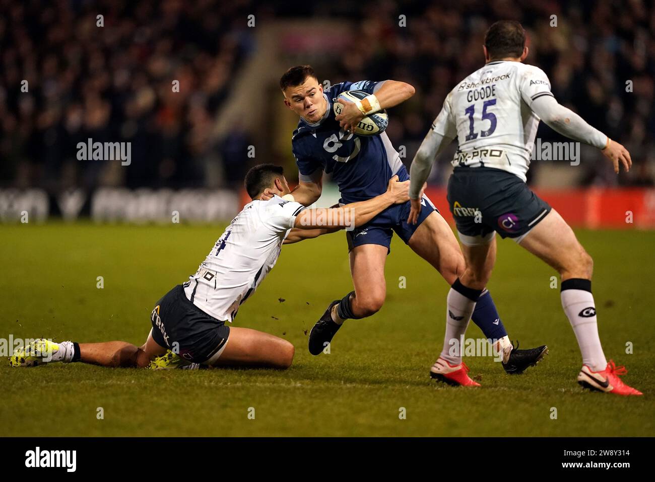 Sale Sharks' Joe Carpenter is tackled by Saracens' Lucio Cinti during ...