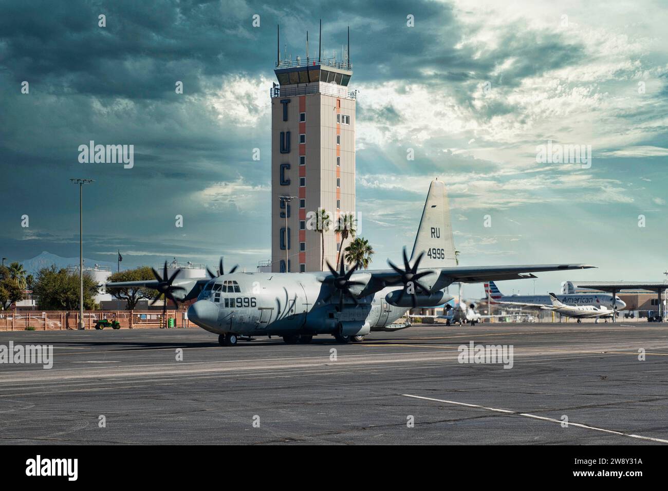C130 of the US Navy taxiies past the Control Tower at Tucson ...