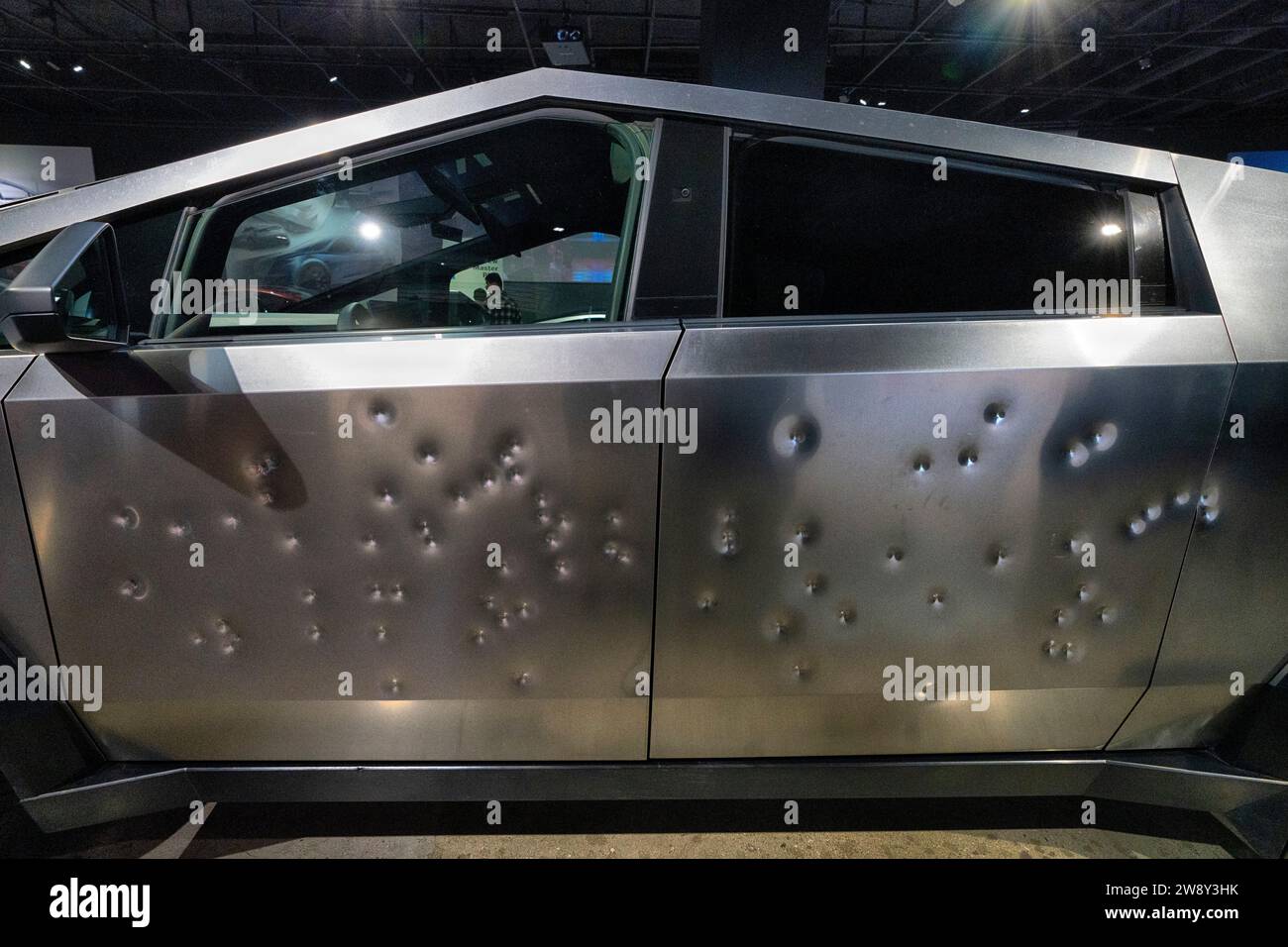 A pockmarked side of a Tesla Cybertruck that was tested by a Thompson ...