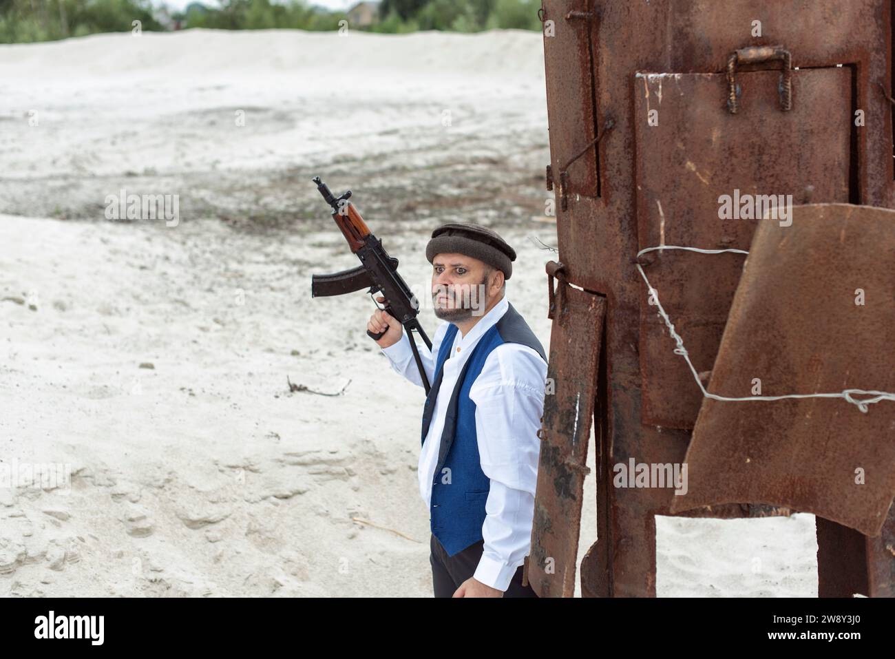 Arab man holding gun hi-res stock photography and images - Alamy