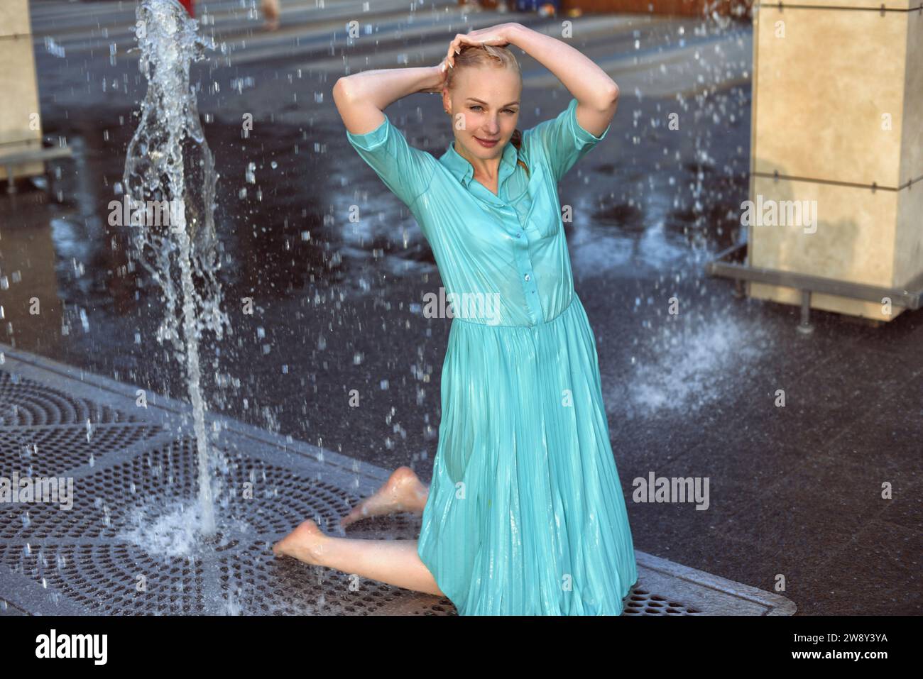 Woman wet clothes in fountain hi-res stock photography and images - Alamy
