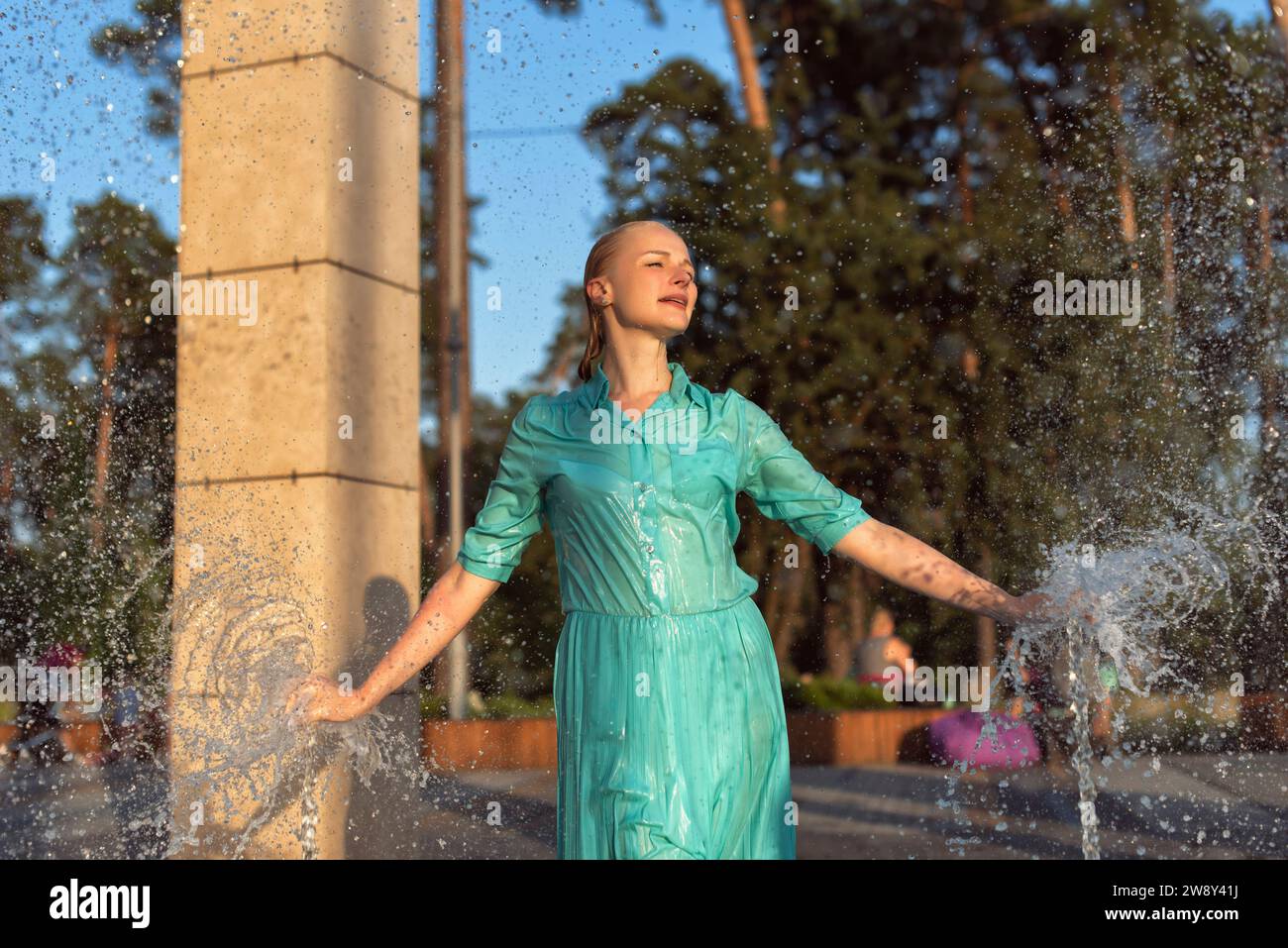 Woman wet clothes in fountain hi-res stock photography and images - Alamy