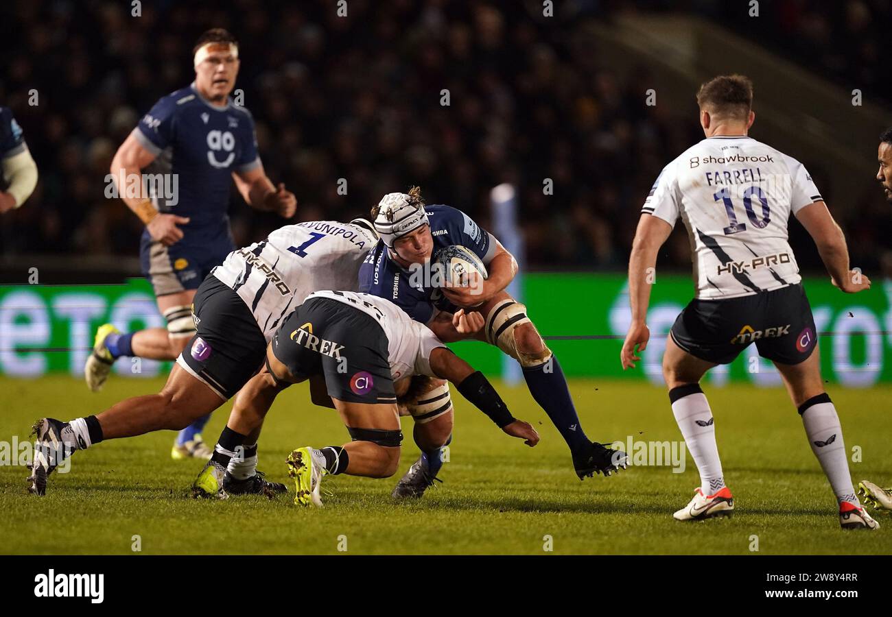 Sale Sharks' Ernst Van Rhyn is tackled by Saracens' Mako Vunipola and ...