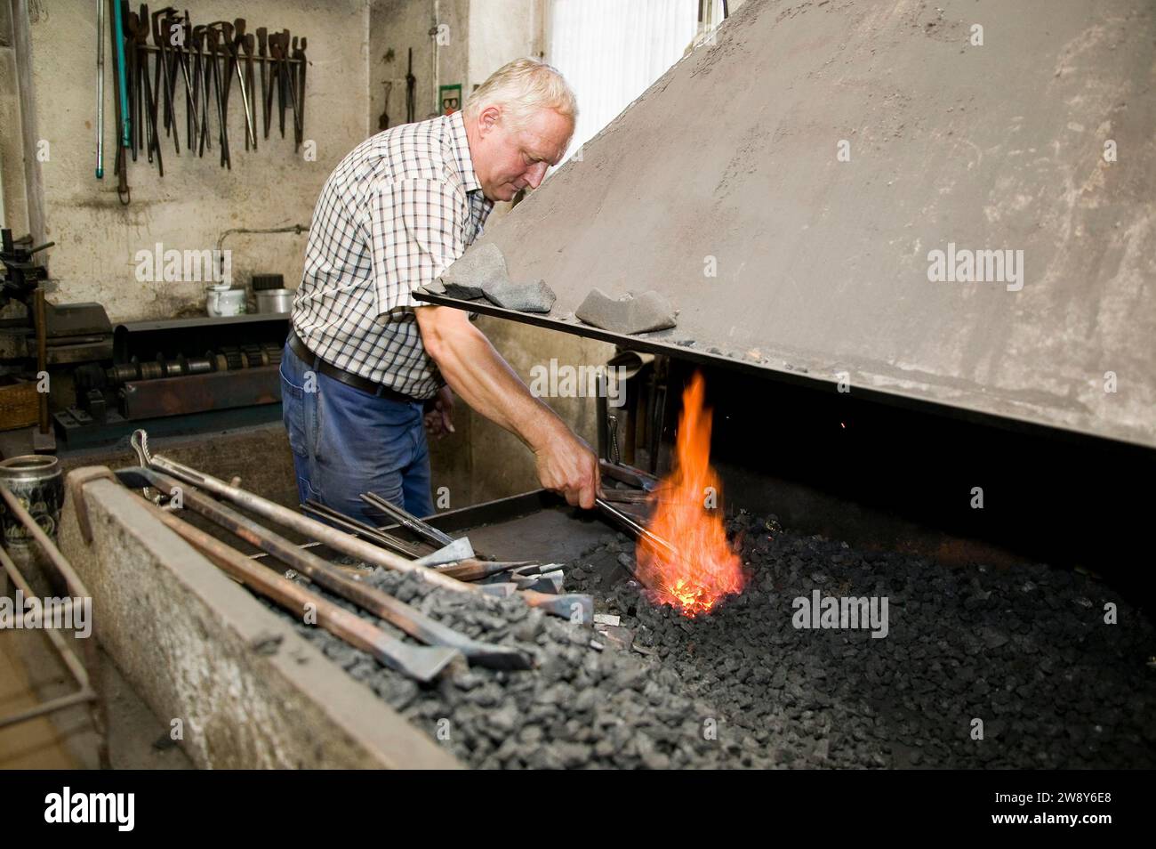 Blacksmith at the Demitz-Thumitz granite works. The granite processing ...