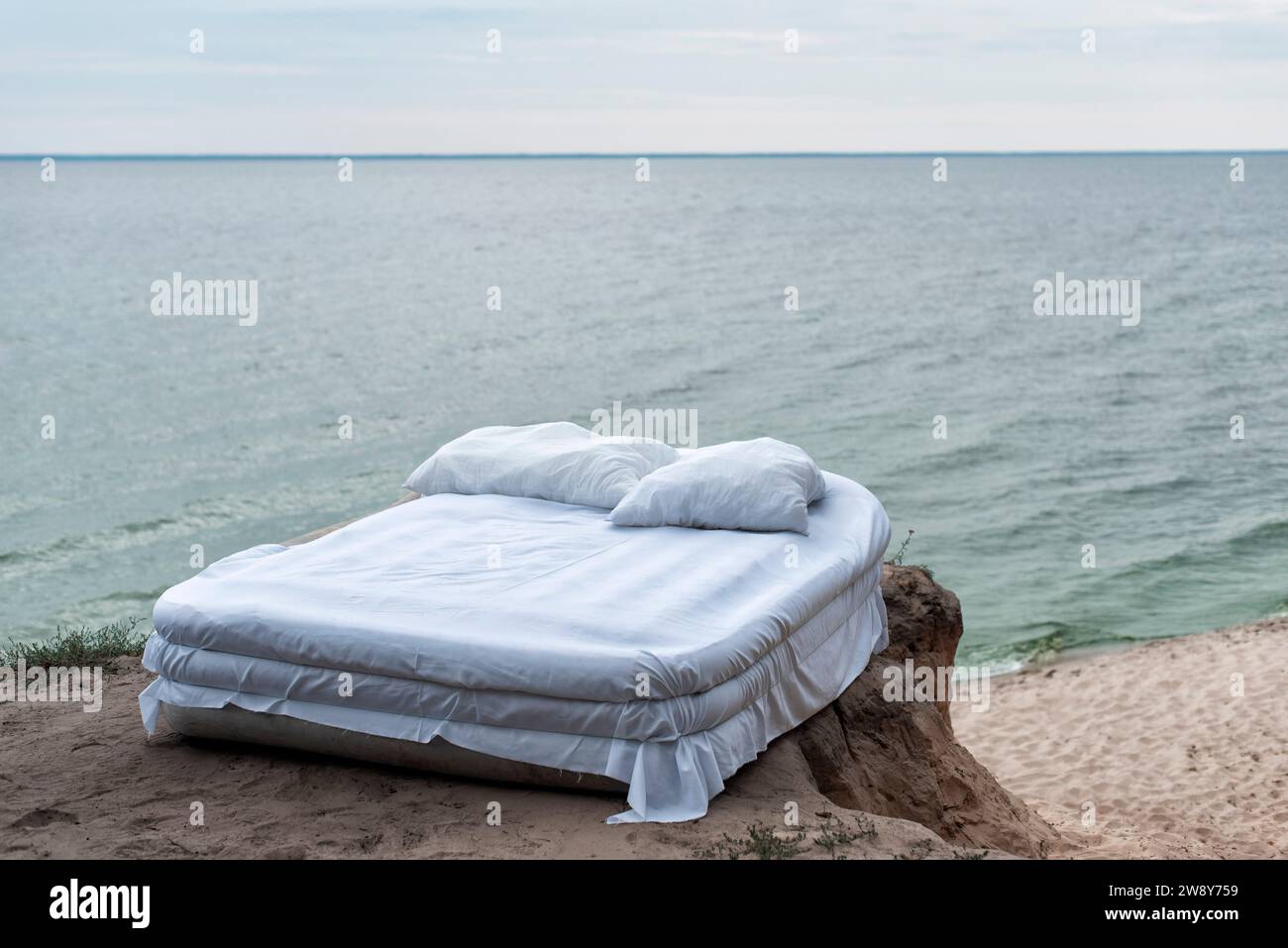 Large bed on the beach near the sea Stock Photo - Alamy