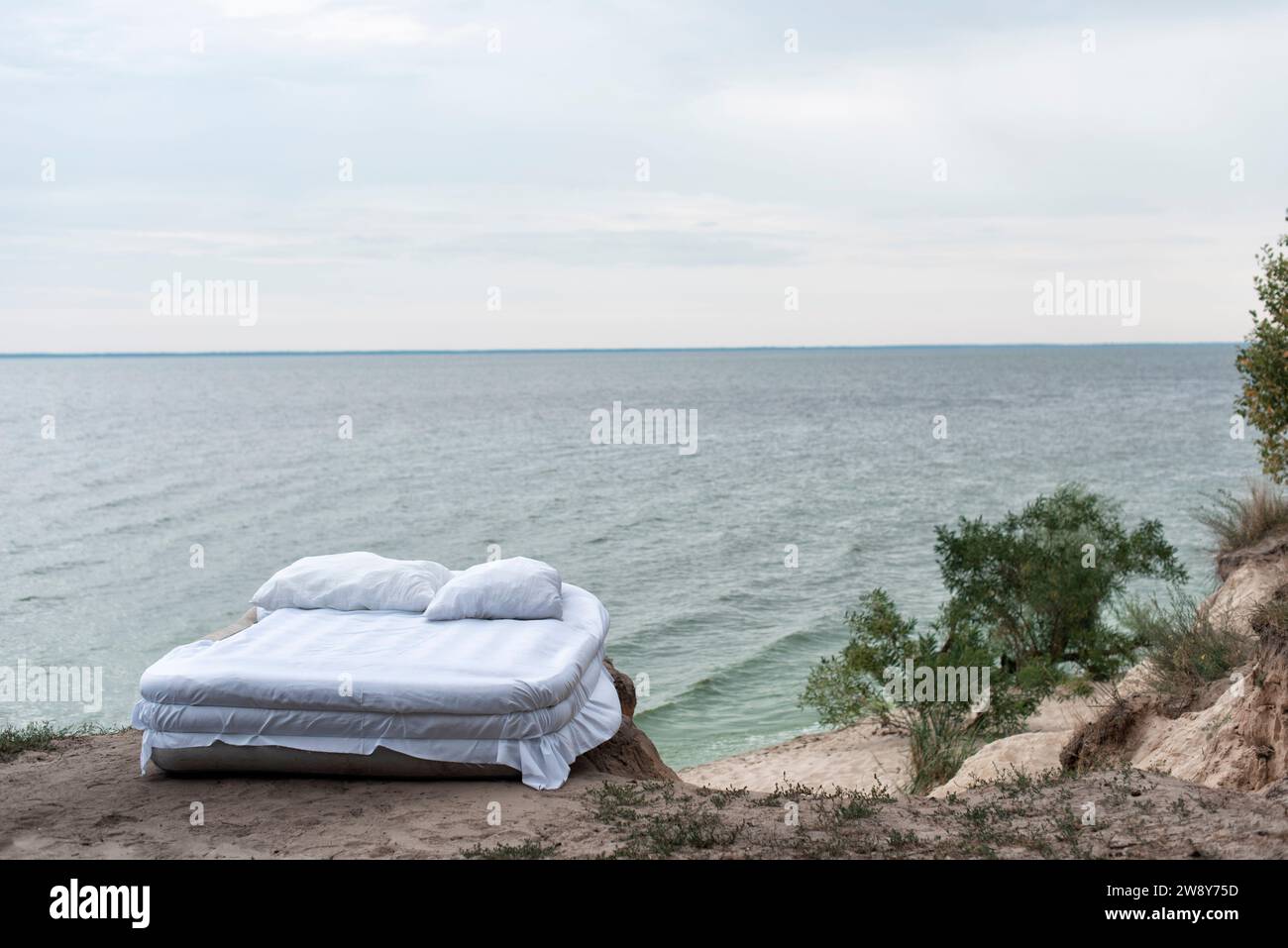 Large bed on the beach near the sea Stock Photo - Alamy