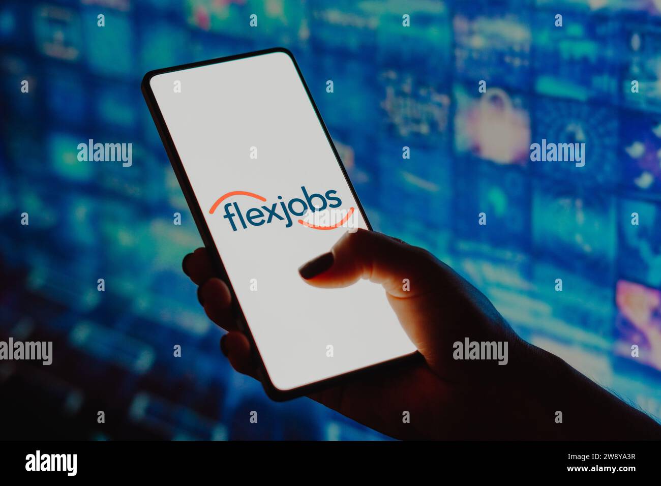 In this photo illustration, the FlexJobs logo is displayed on a ...