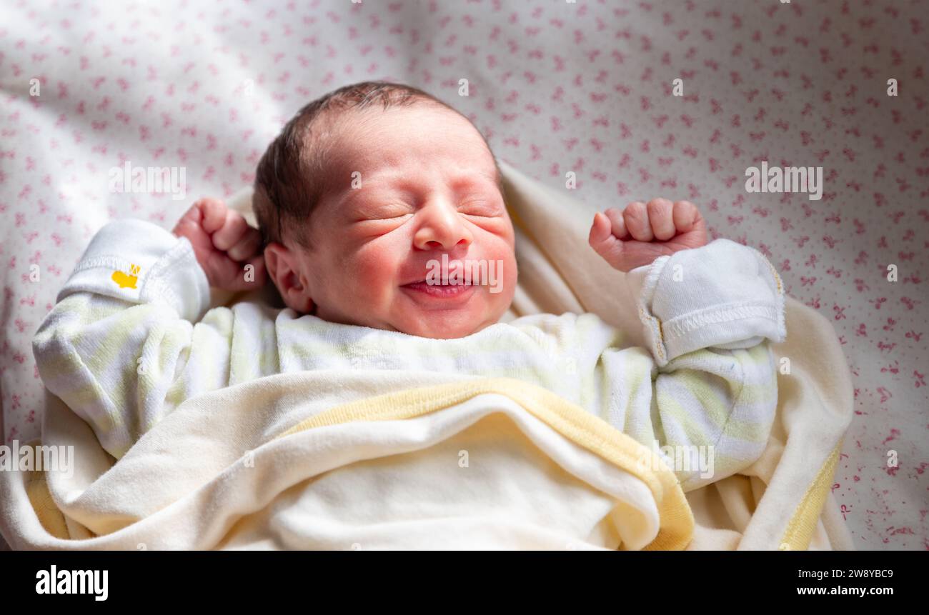 A new family member reactions with sun light and smile on his face ...