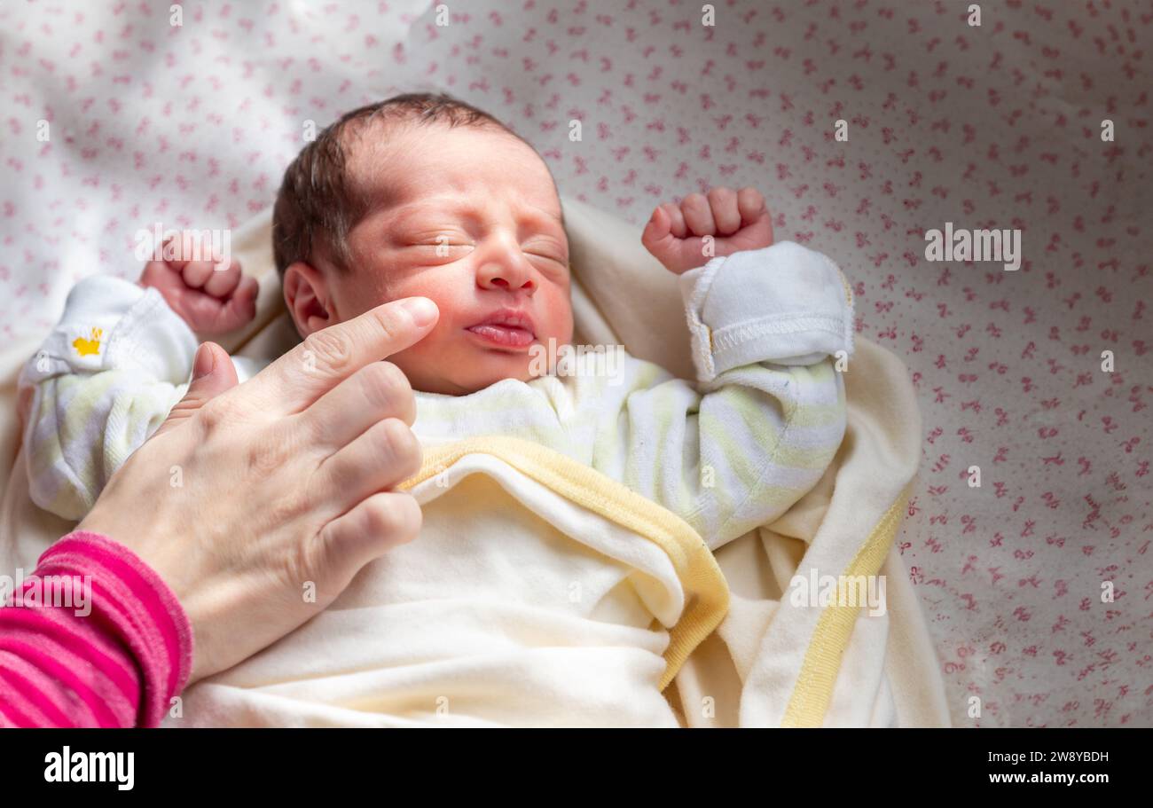A new family member reactions with sun light and smile on his face ...