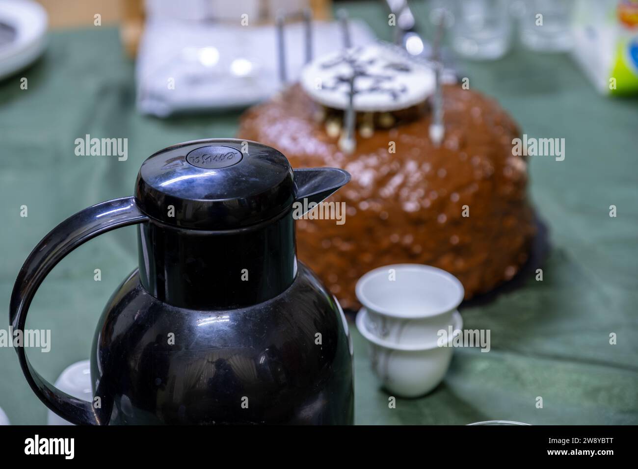 Arabic coffee and chocolate cake on green background for birthday ...