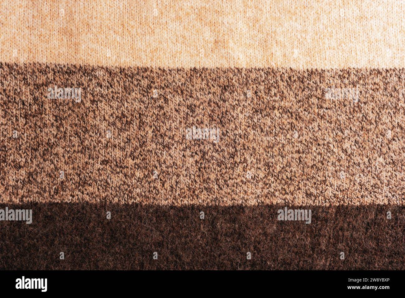 Beige and brown striped woolen knitted sweater fabric, texture ...