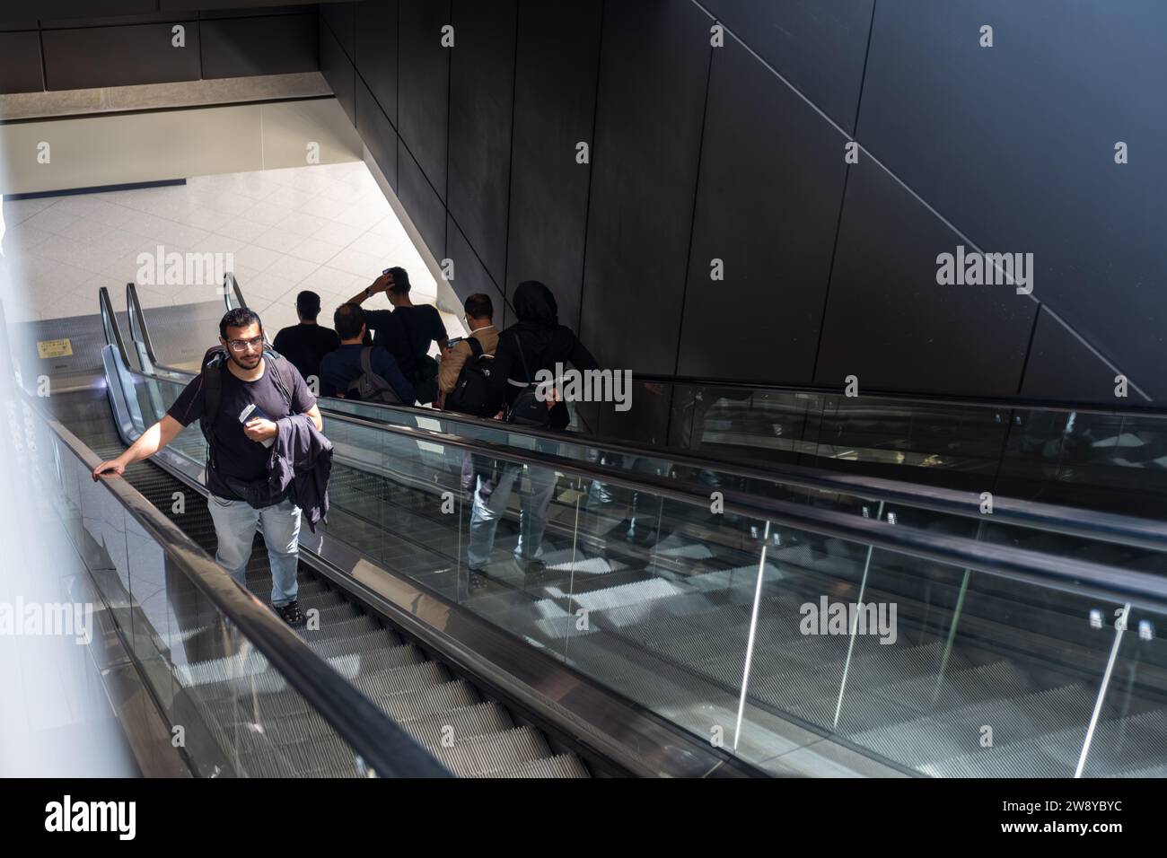 Cheerful male holding his passport after long journey feeling excited ...