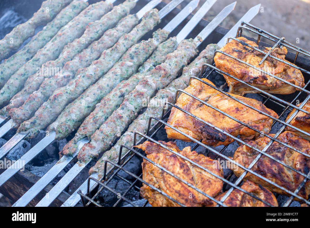 Kebab on fire, grilling kabob on charcoal during picnic Stock Photo - Alamy