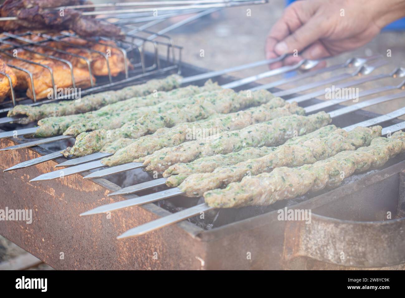 Kebab on fire, grilling kabob on charcoal during picnic Stock Photo - Alamy