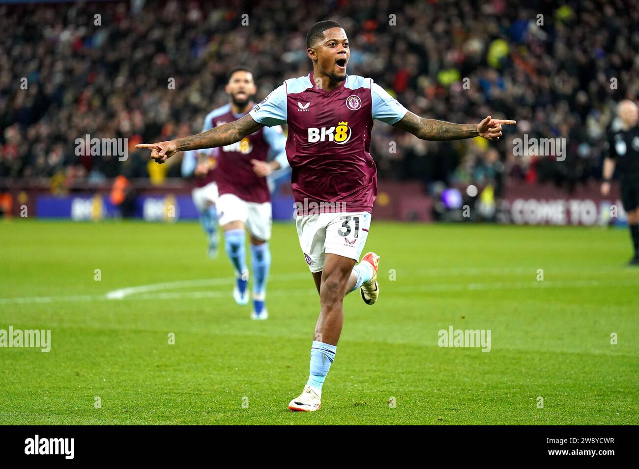Aston Villa's Leon Bailey (left) celebrates scoring their side's first ...