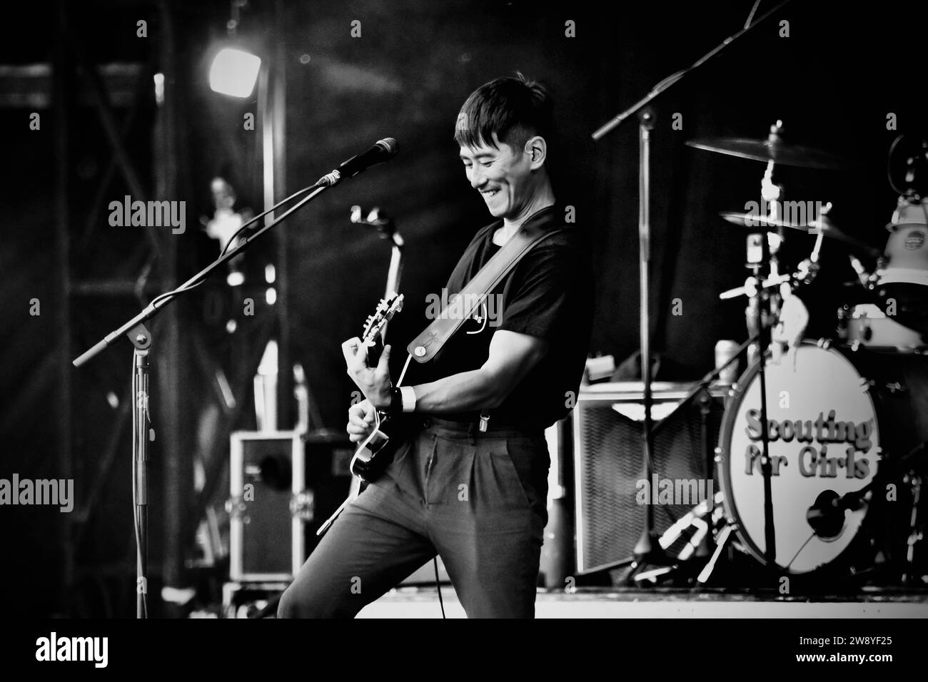 Nick Tsang playing guitar with Scouting for Girls as they performed at ...