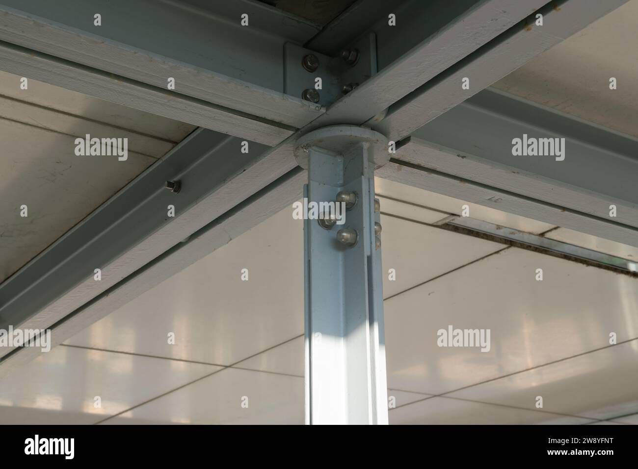 construction detail of the white painted steel structure with bolts and ...