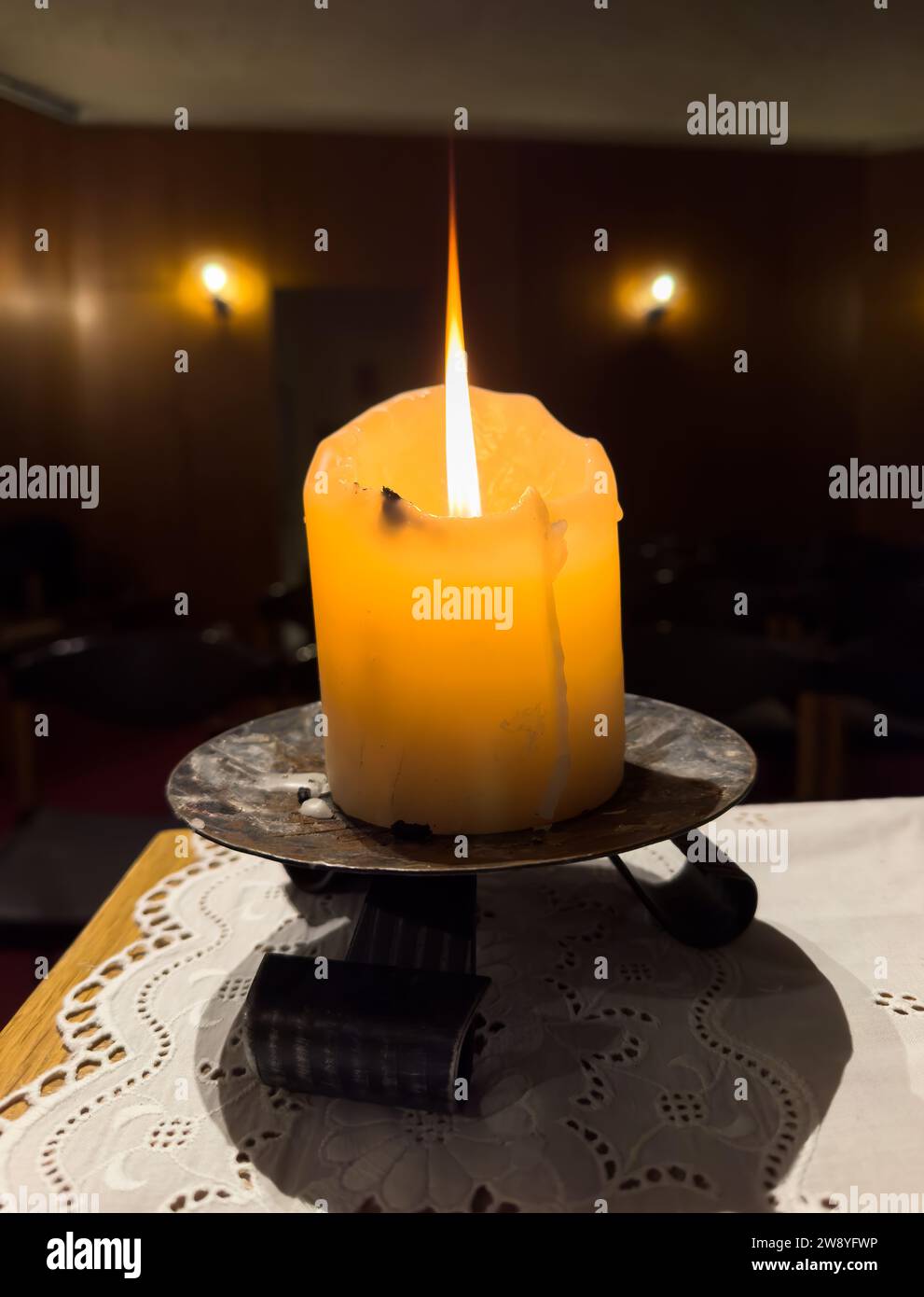 Burning candle in the chapel with a big flame Stock Photo - Alamy