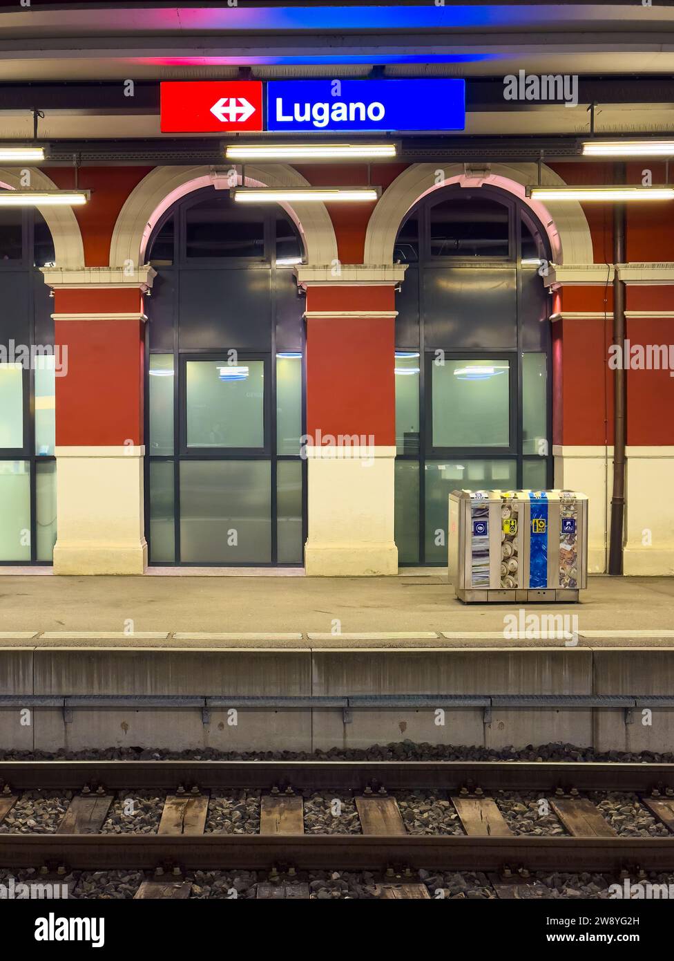 Lugano, Switzerland - December 2, 2023: A railway station sign of the ...