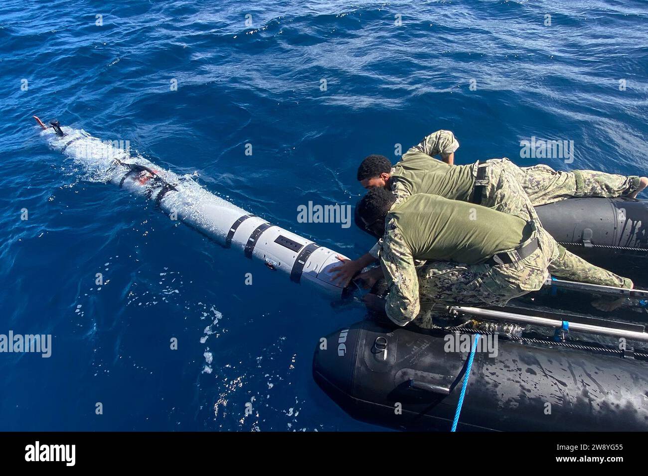 Guam. 4th Dec, 2023. Sailors recover an MK 18 Mod 2 unmanned underwater ...