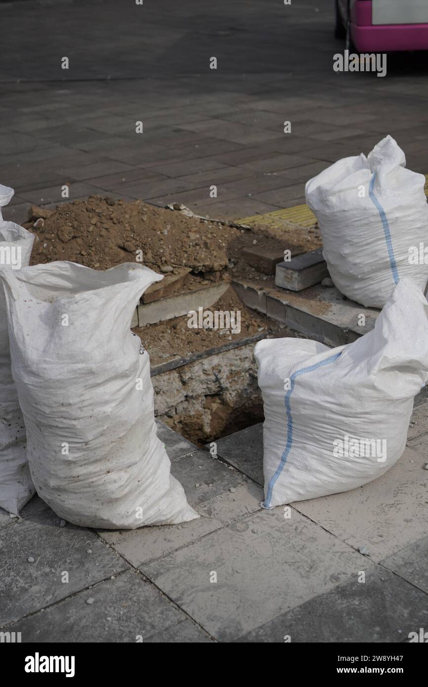 repair of water channels, and soil in sacks Stock Photo - Alamy