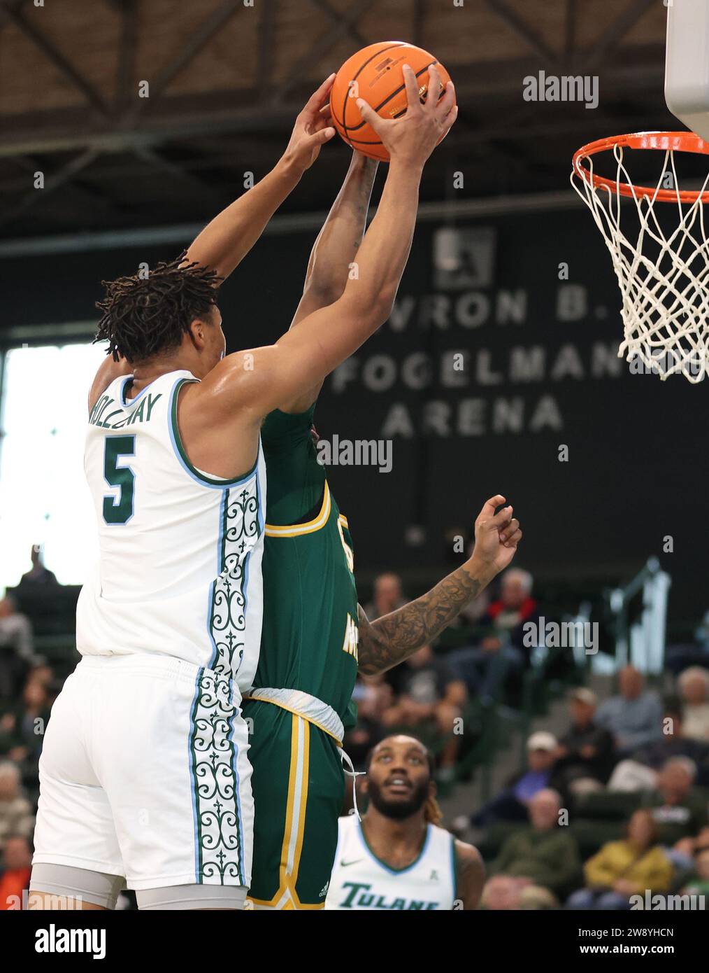 New Orleans, USA. 22nd Dec, 2023. Both Tulane Green Wave forward Collin ...