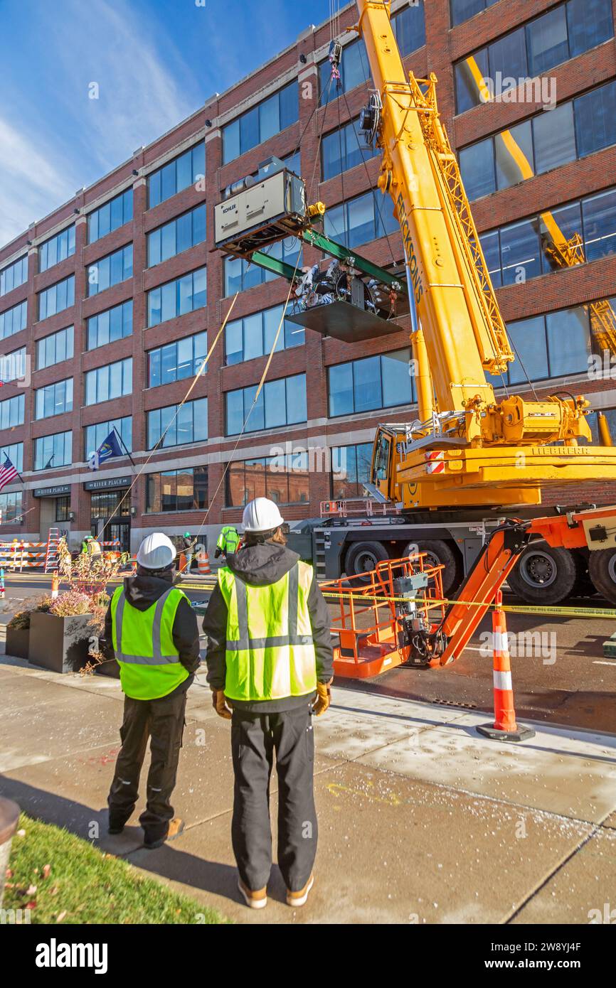Detroit, Michigan - A large printer is lifted through the third floor ...